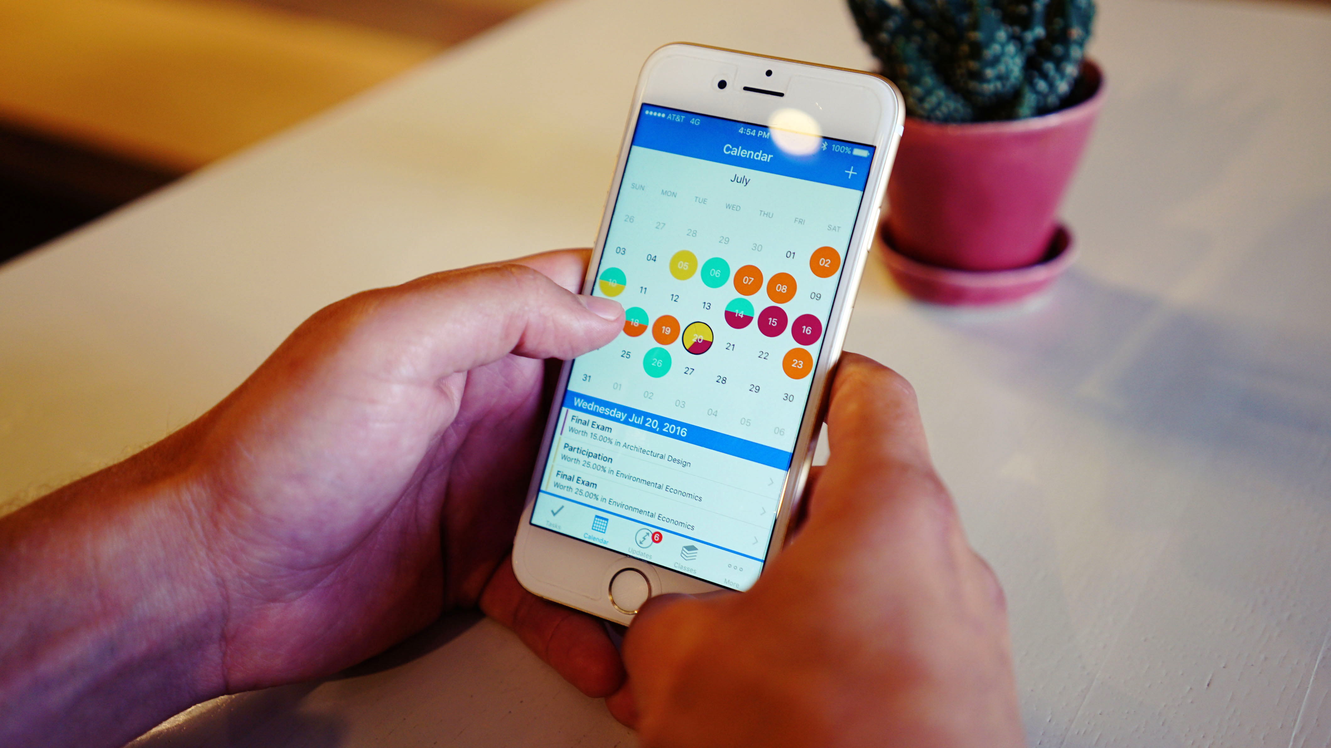Hand Holding An Iphone With A Calendar Image Free Stock Photo