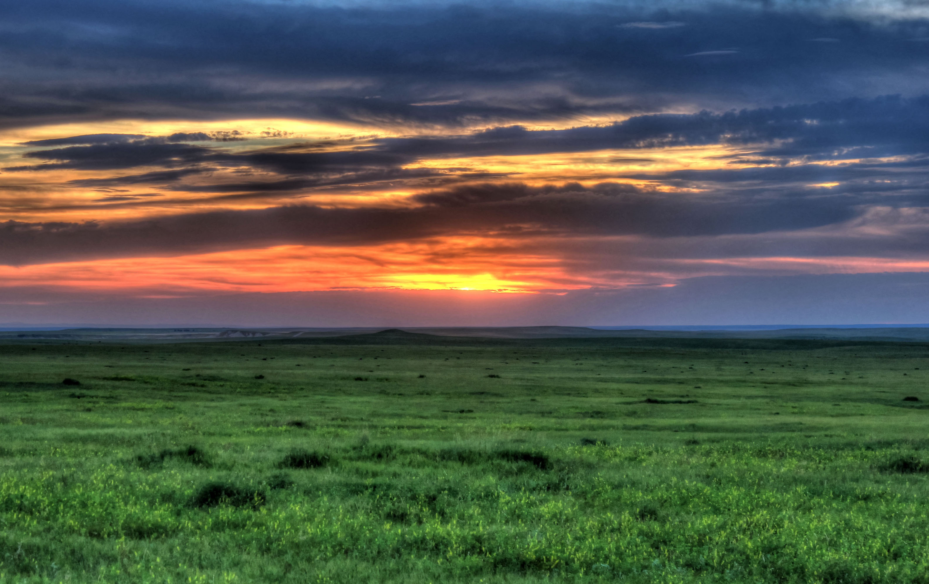 Sunset Over The Grassland At Badlands National Park South Dakota Image Sunset Over The Grassland At Badlands National Park South Dakota Image