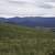 Overlapping hill landscape with mountains in the background in Helena ...
